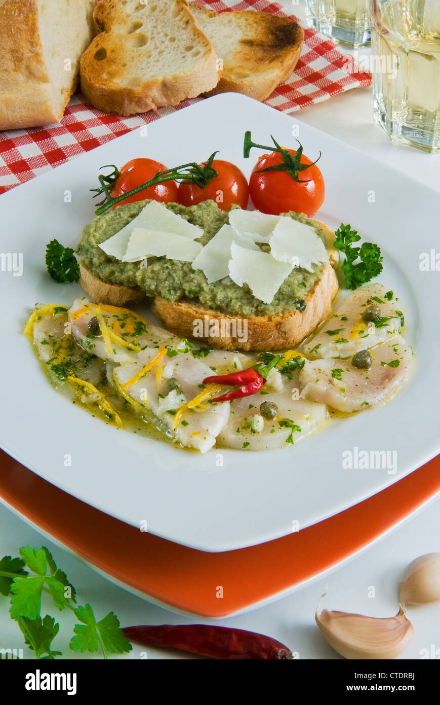 Cod carpaccio (Carpaccio is a dish of raw meat or fish) with crostino ...
