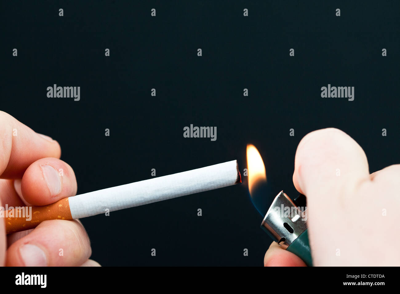 Someone lighting a cigarette Stock Photo - Alamy