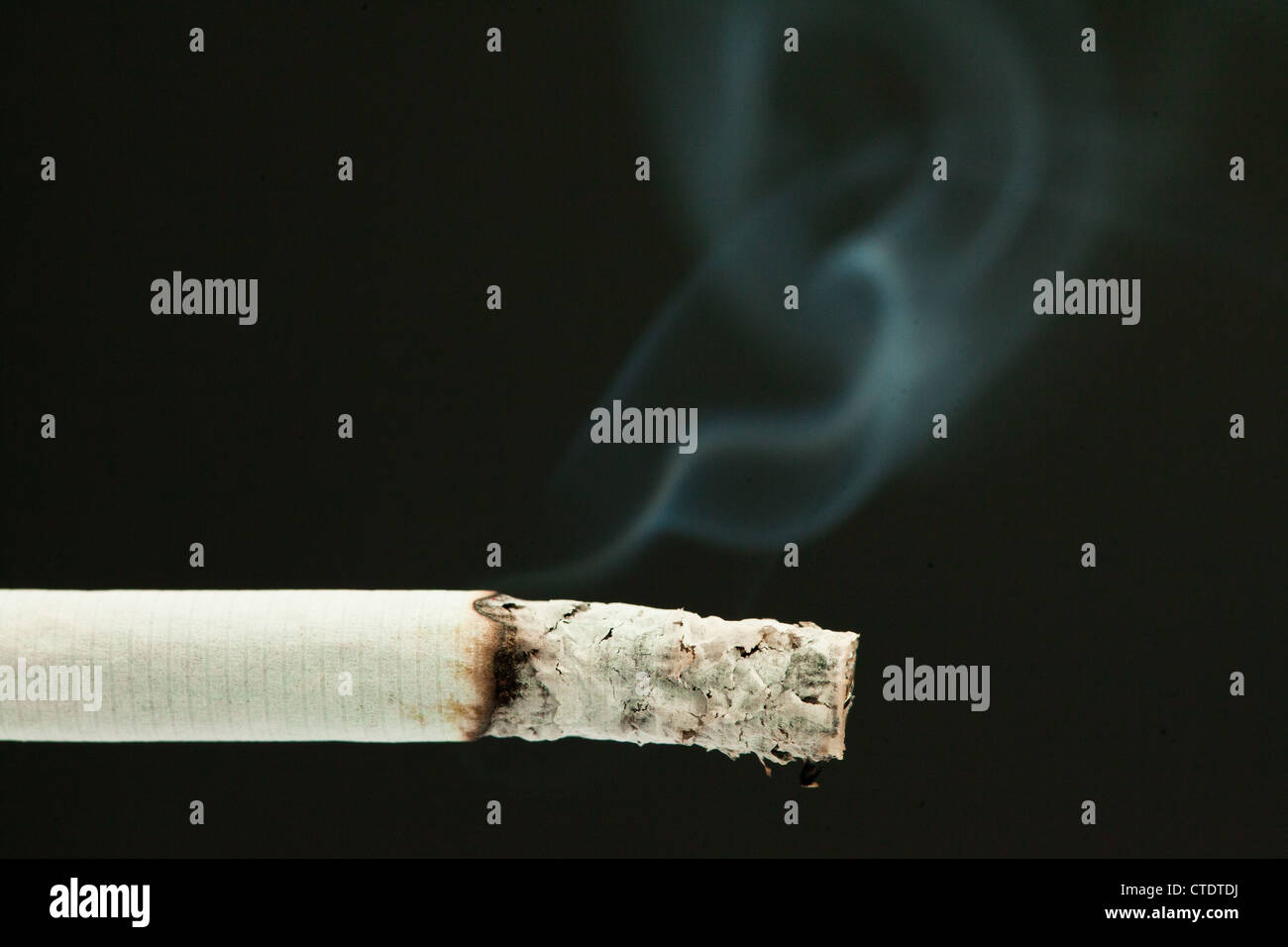Lighted cigarette hi-res stock photography and images - Alamy