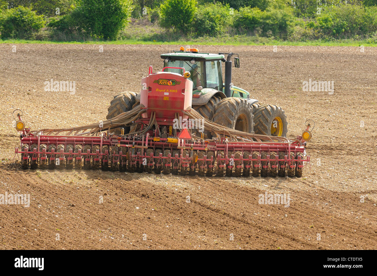 UK arable farming, tractor with seed drill, drilling spring barley ...