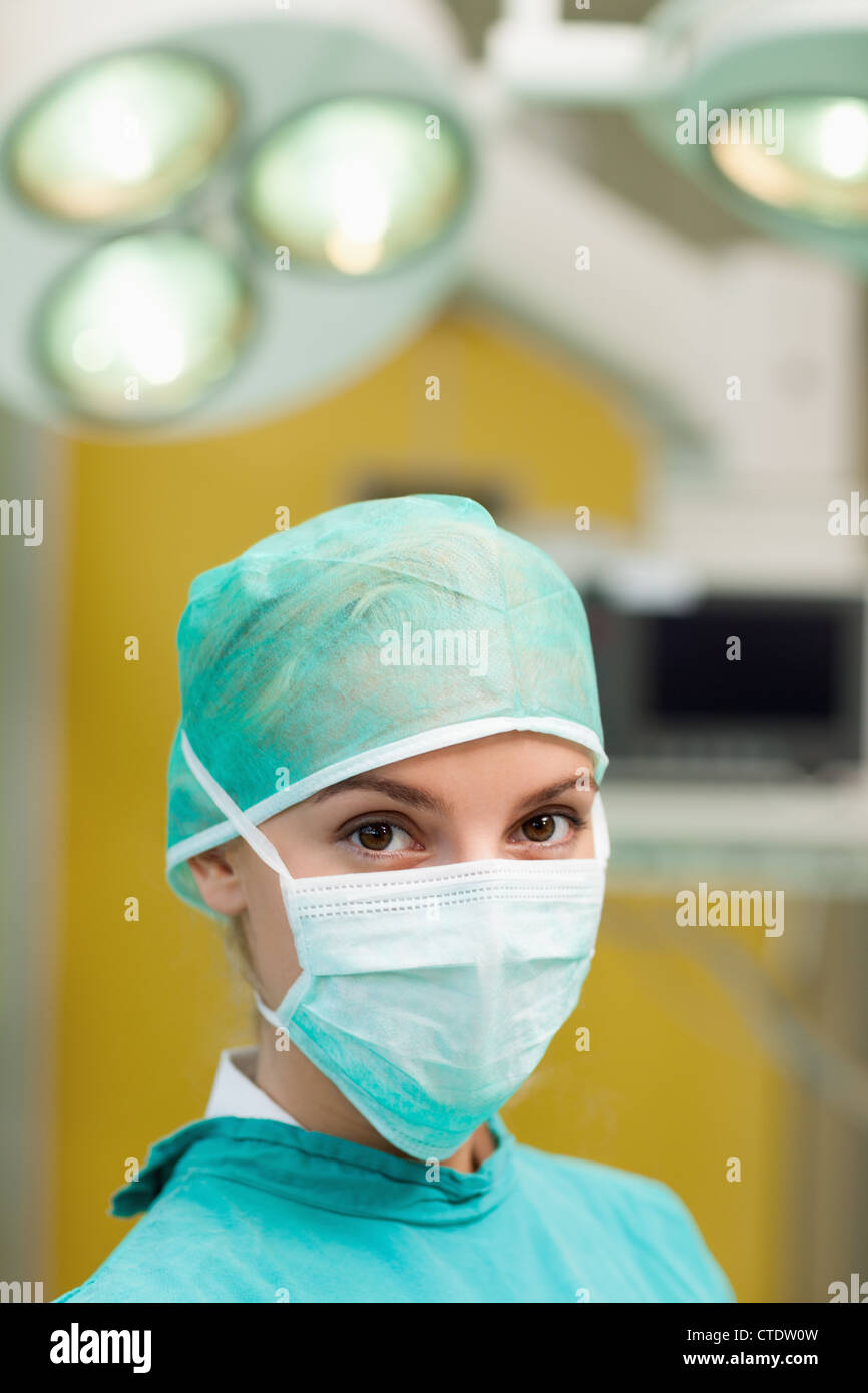 Woman standing and wearing a surgical gear Stock Photo - Alamy