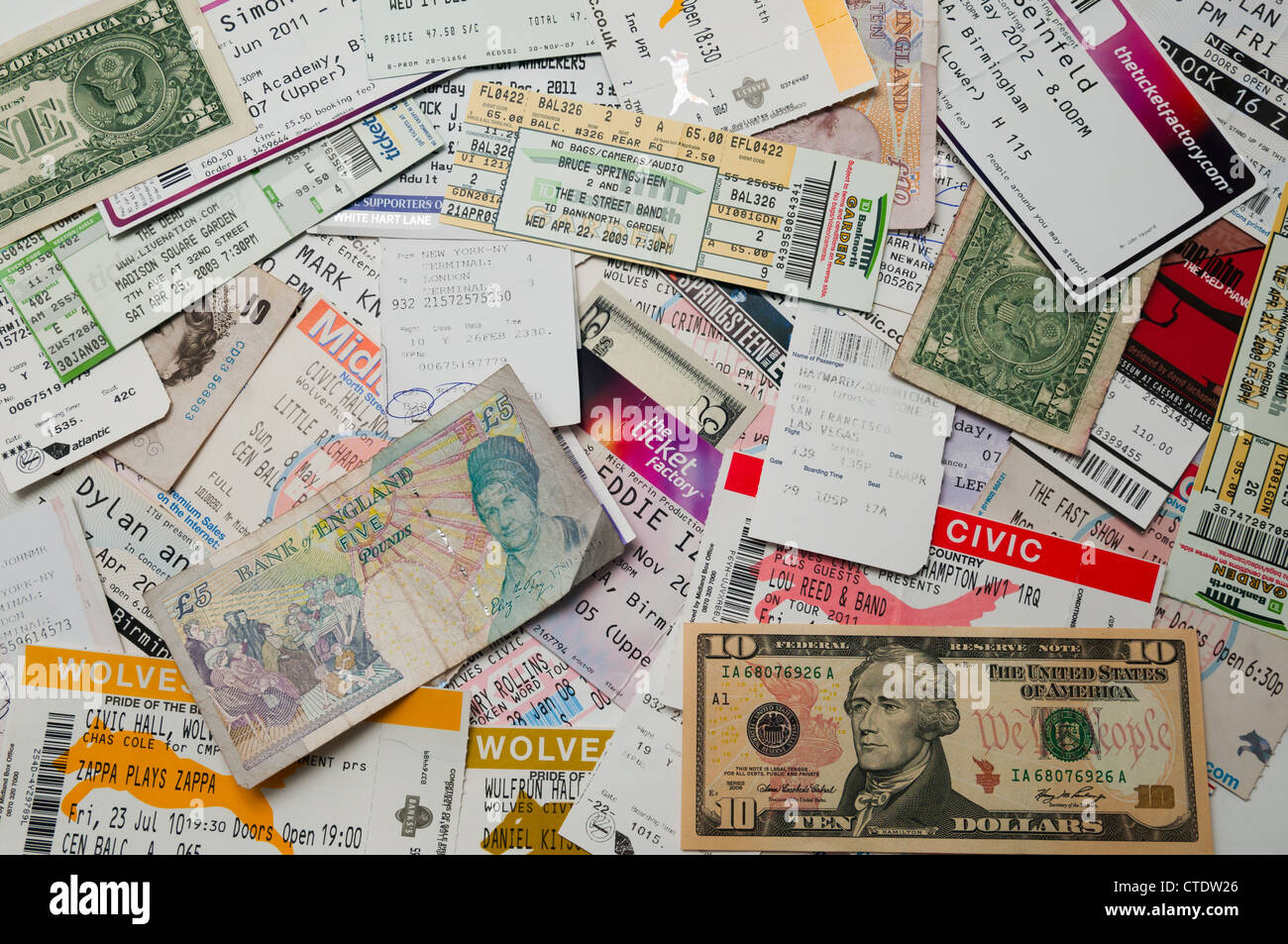 A pile of concert tickets, plane tickets and money Stock Photo - Alamy