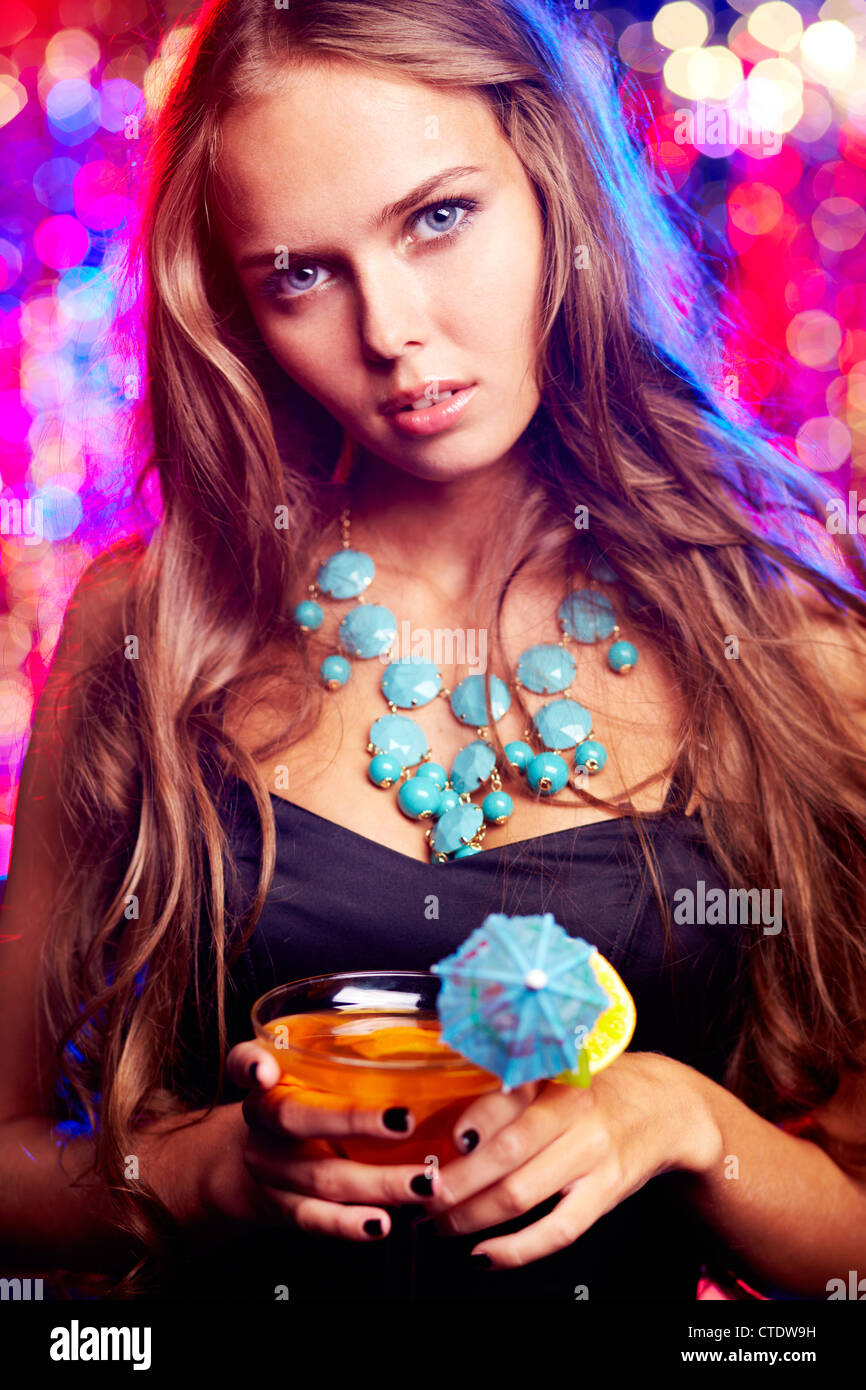 Image of pretty girl with cocktail in the night club Stock Photo - Alamy
