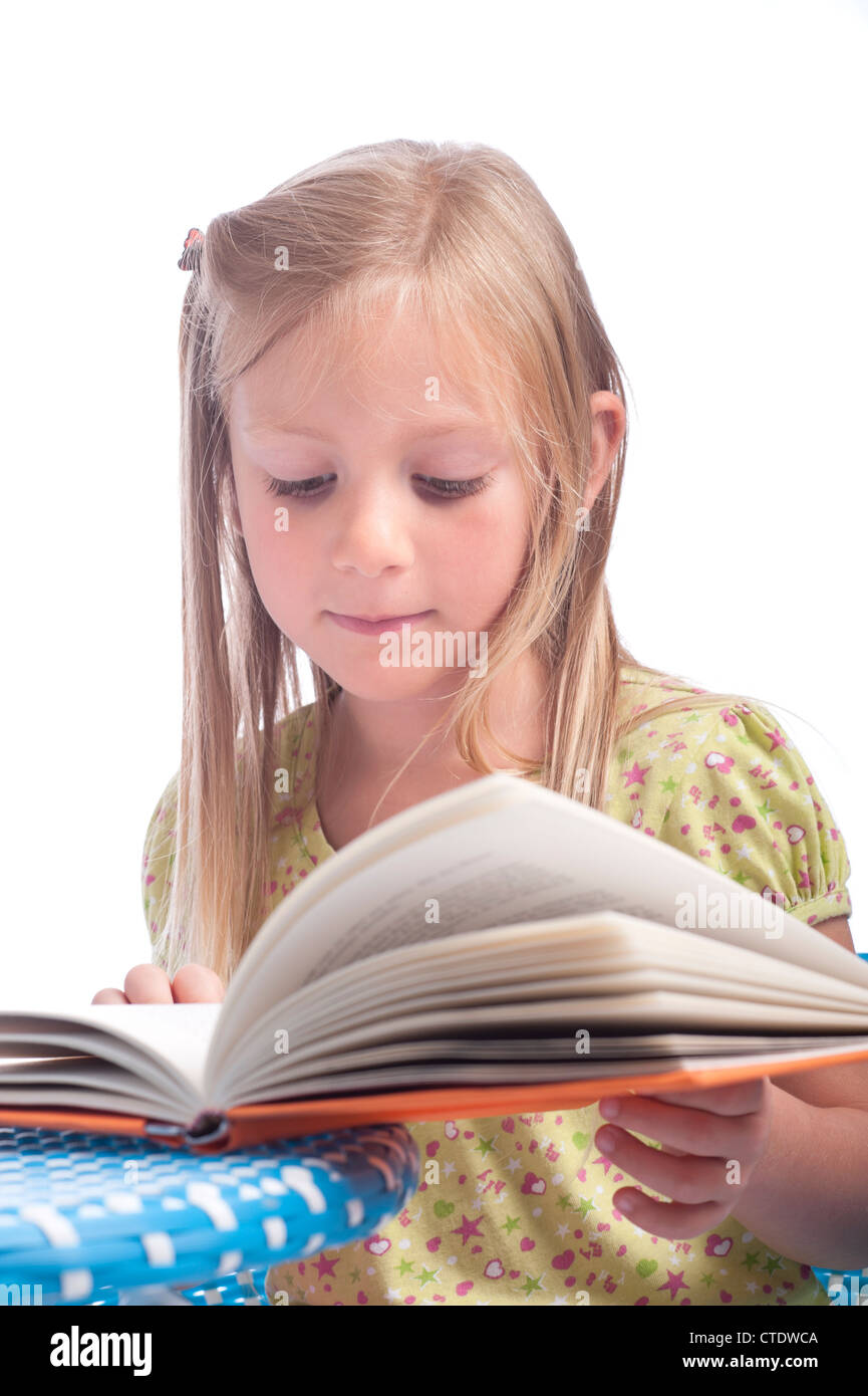 little girl reading a book Stock Photo - Alamy