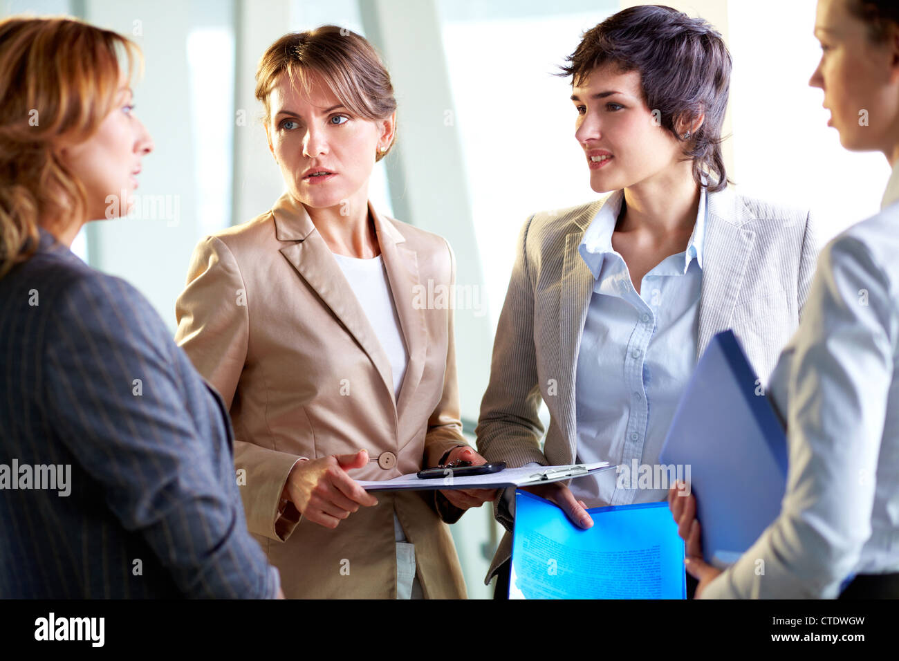 Female leader of the business team being concerned about the results of ...