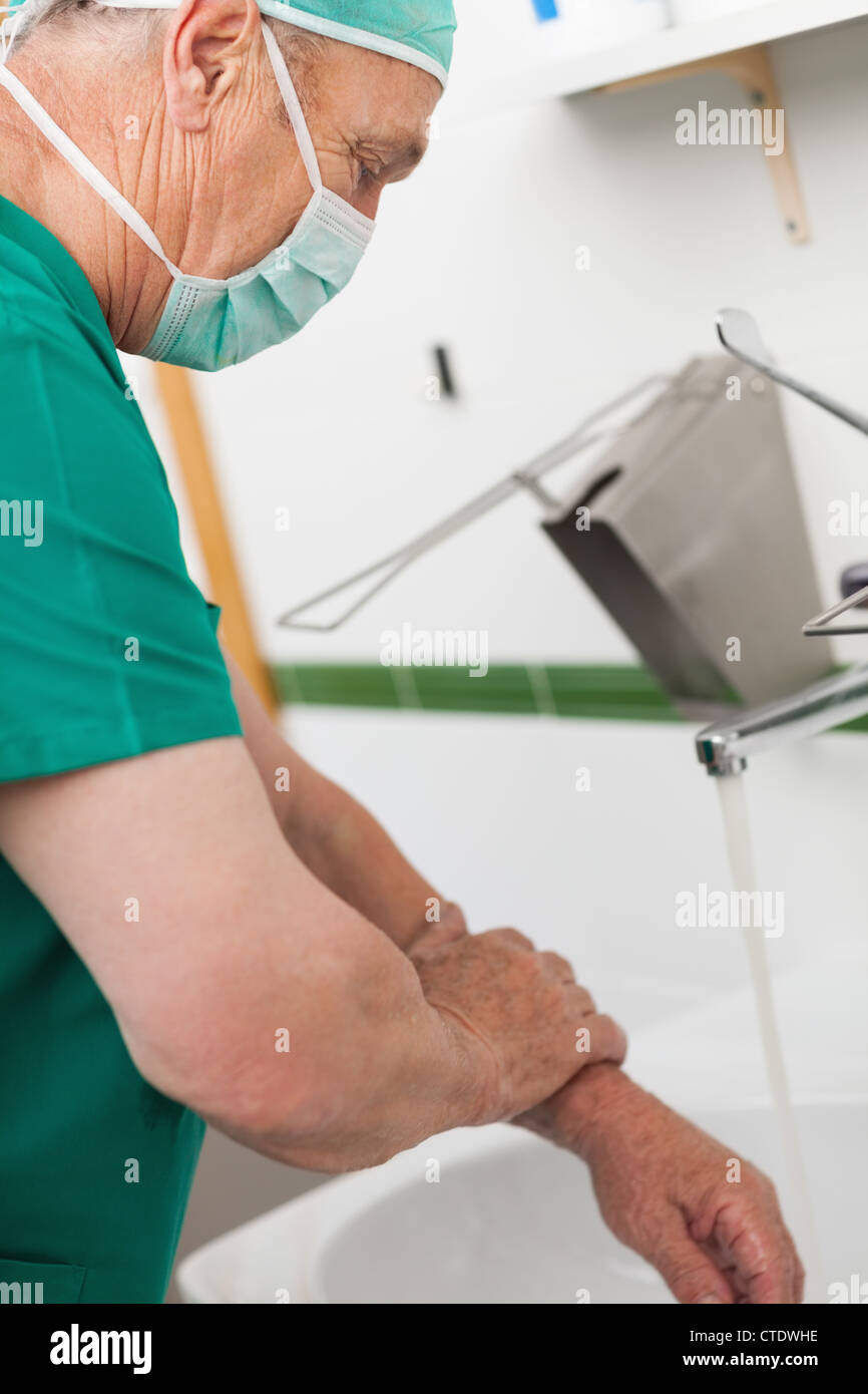 Surgeon washing his hands Stock Photo - Alamy