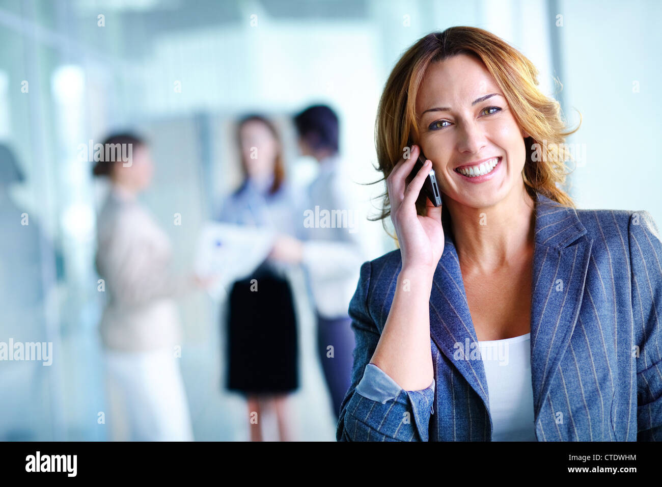 Office worker making a phone call understanding the importance of ...
