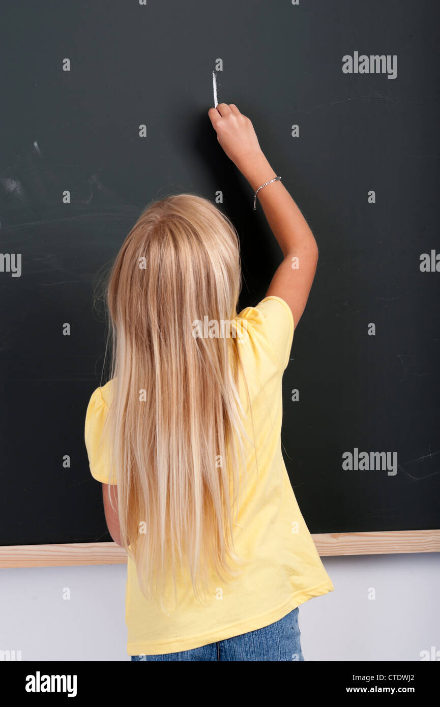 backview of girl writing o a blackboard Stock Photo - Alamy