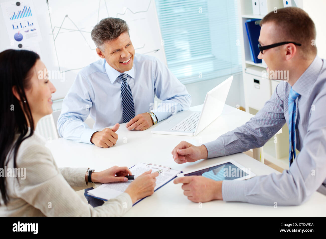 Smiling business people being satisfied with the ideas generated while ...