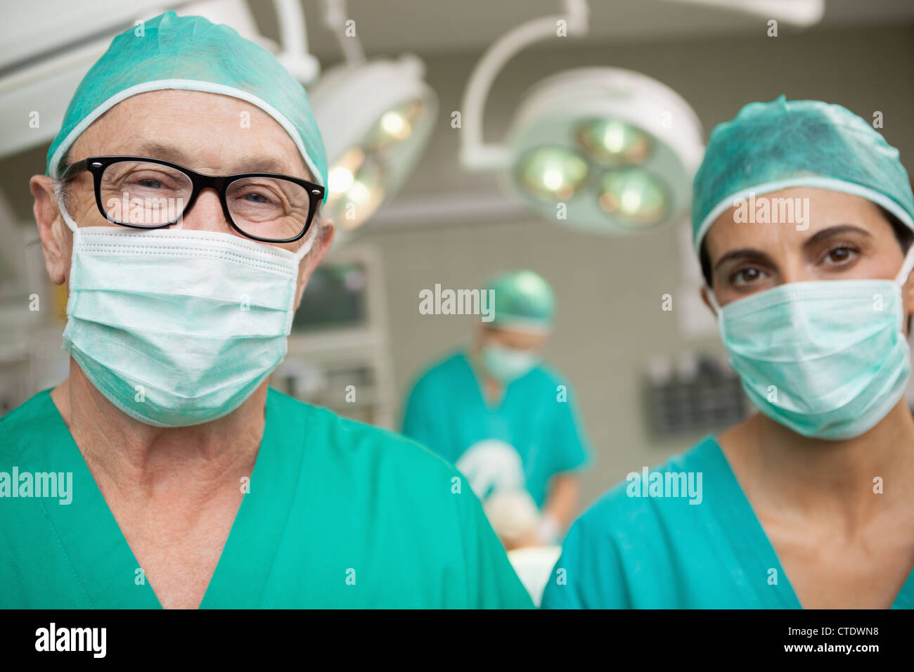 Surgeons standing up Stock Photo - Alamy