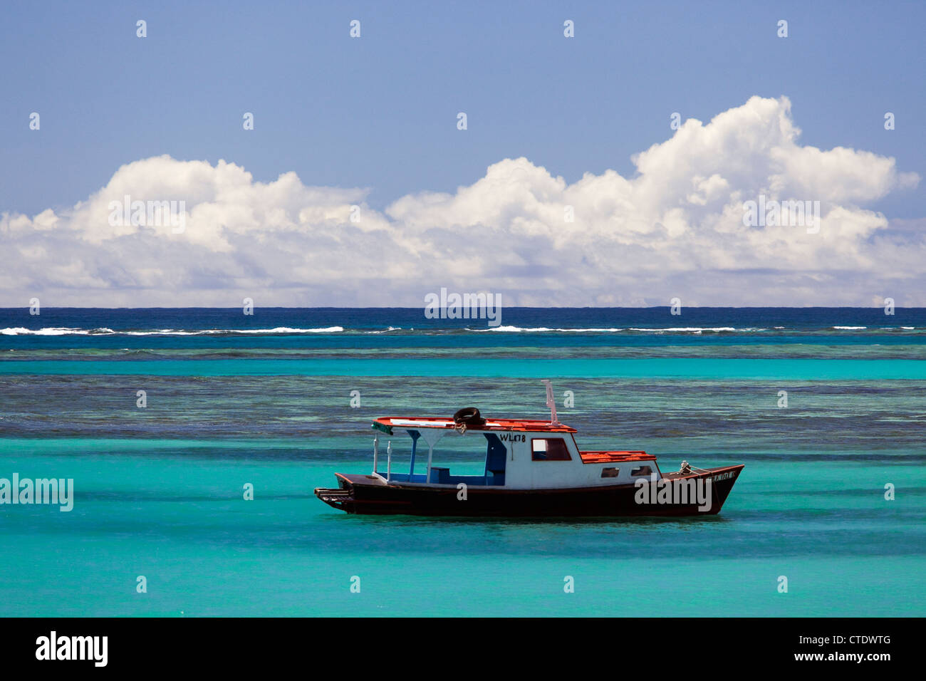 Tropical seascape with fishing boats Stock Photo - Alamy