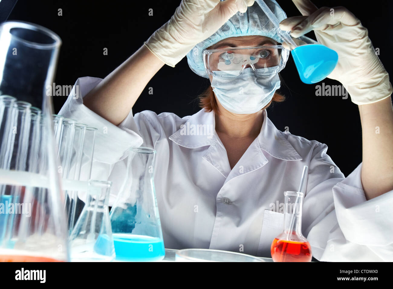 Surprised researcher studying the substance in a beaker Stock Photo - Alamy