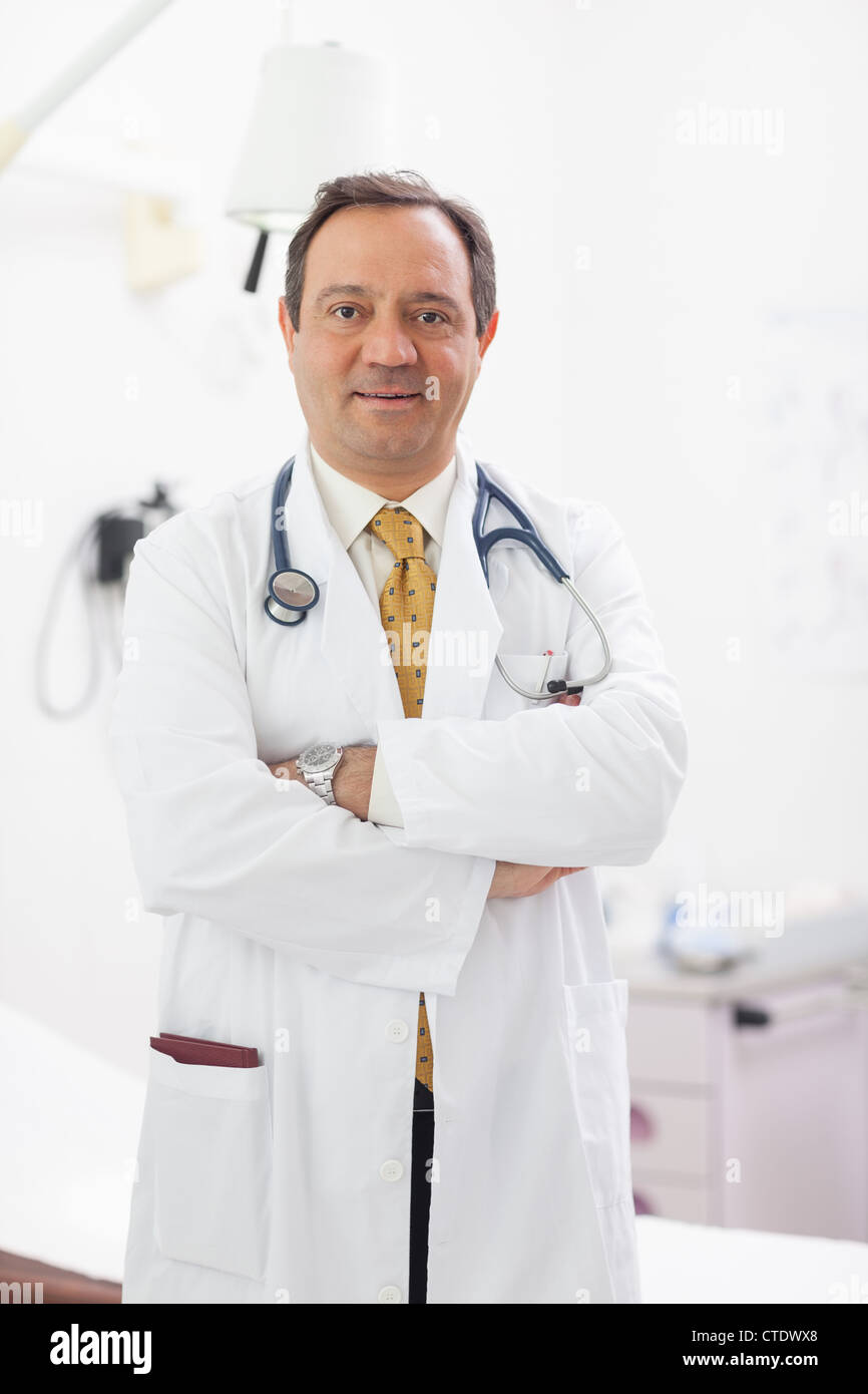 Doctor with his arms folded Stock Photo - Alamy