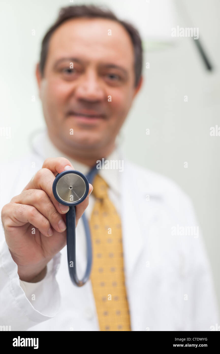Doctor holding a stethoscope Stock Photo - Alamy