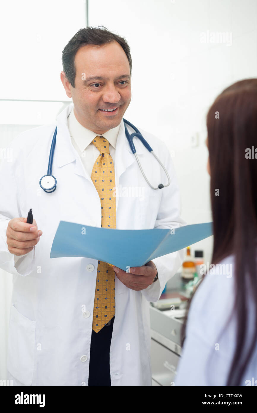 Joyful doctor examining patient hi-res stock photography and images - Alamy