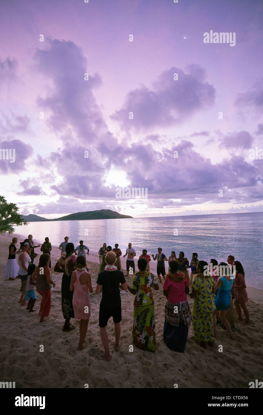 Nacula Island, Fiji; dancing on the beach at sunset Stock Photo - Alamy