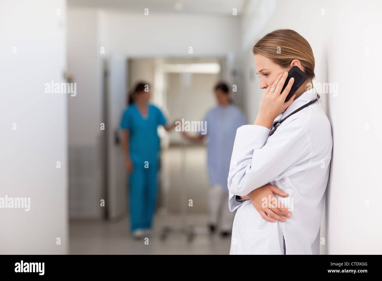 Female doctor folding arms hi-res stock photography and images - Alamy