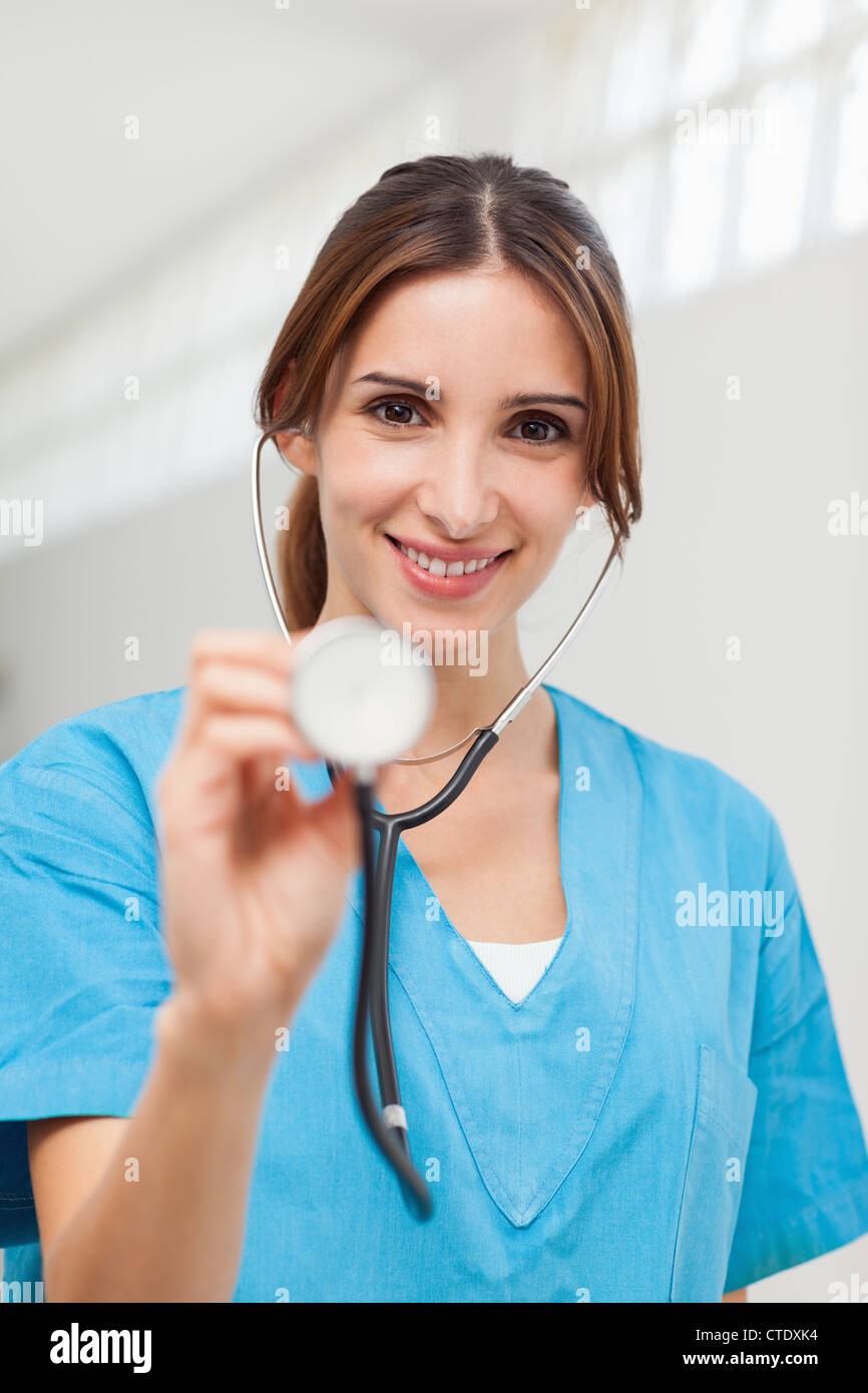 Nurse holding a stethoscope Stock Photo - Alamy