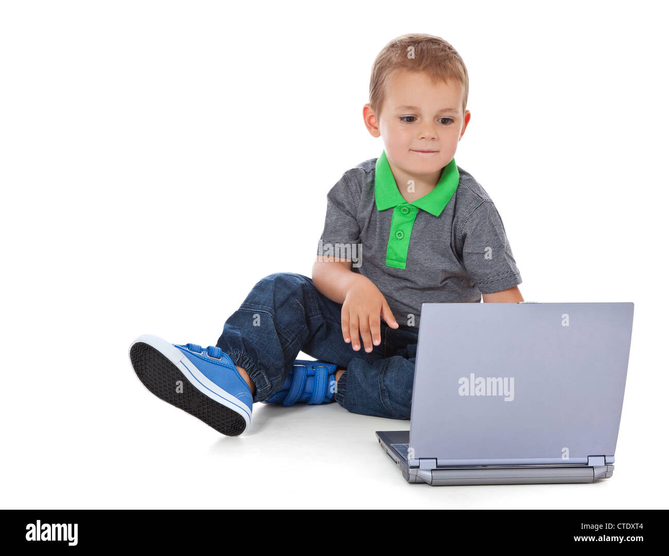 Full length shot of a cute little boy sitting on the floor with a ...