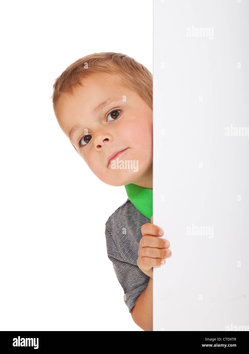 Cute little boy hiding behind a white wall. All isolated on white ...