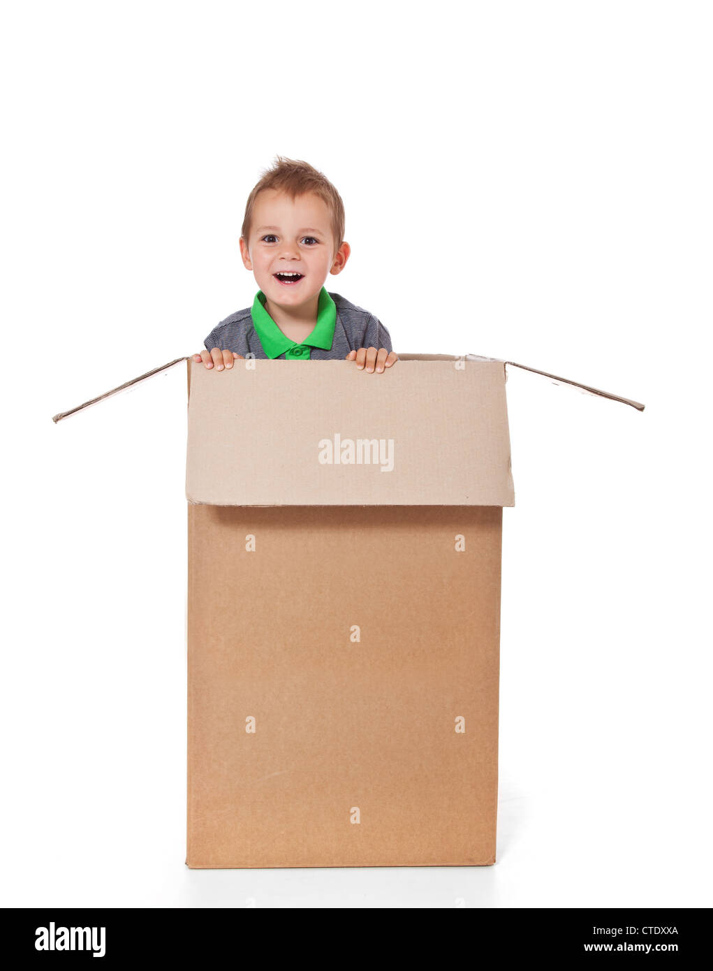 Cute little boy sitting in a box. All isolated on white background ...