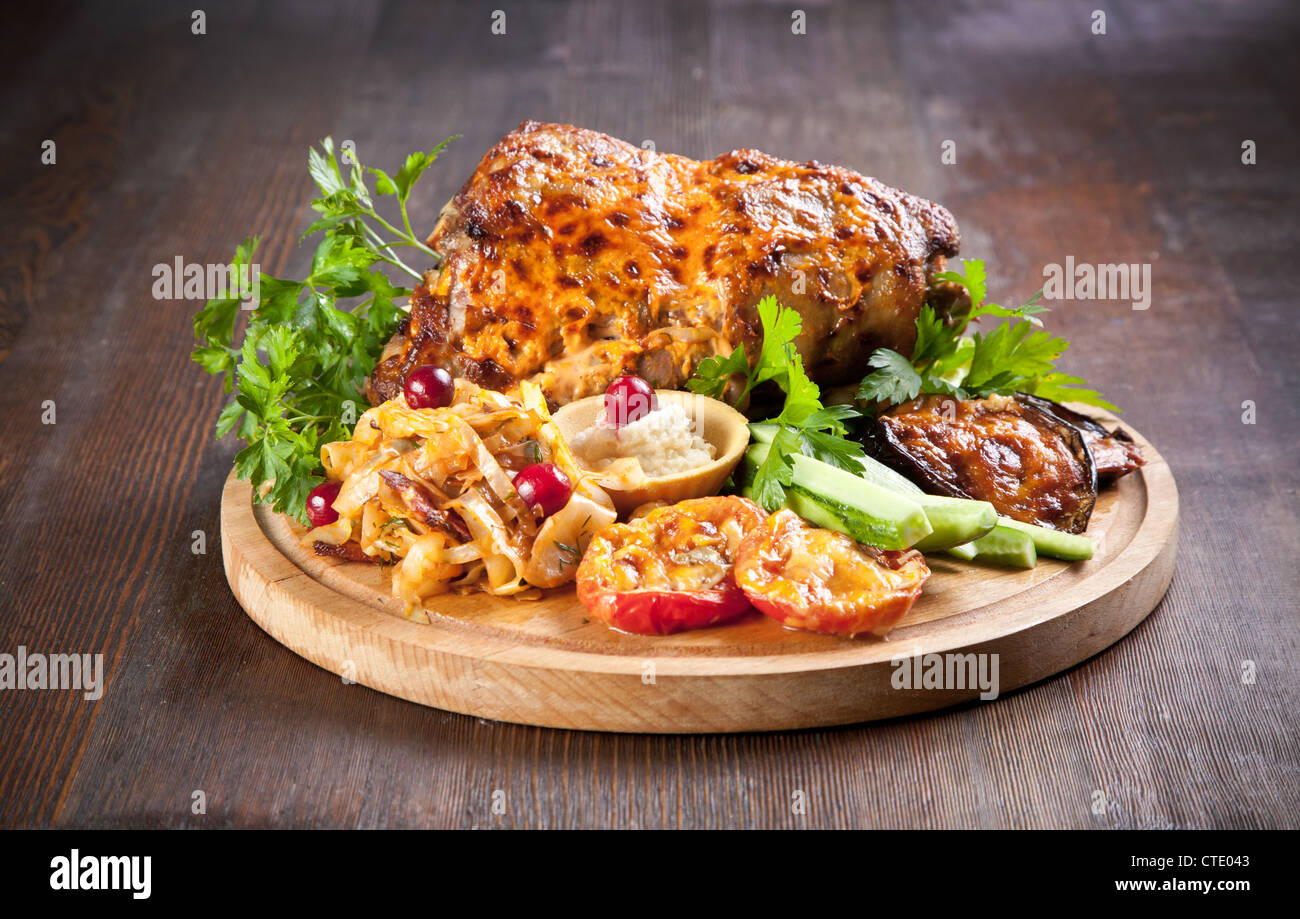 Grilled knuckle of pork with vegetables Stock Photo - Alamy