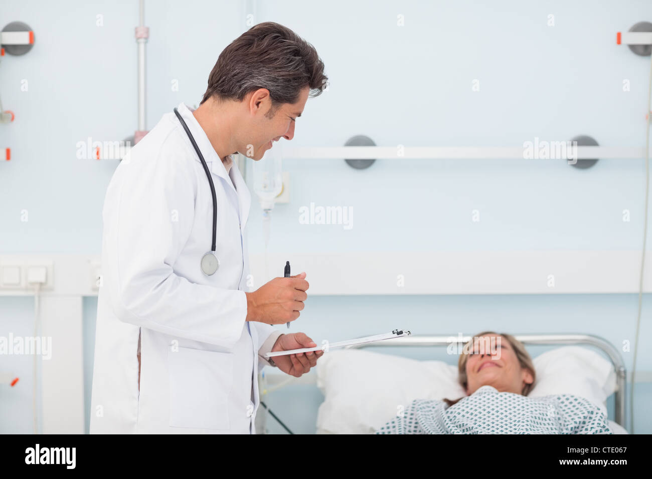 Doctor speaking with his patient Stock Photo - Alamy