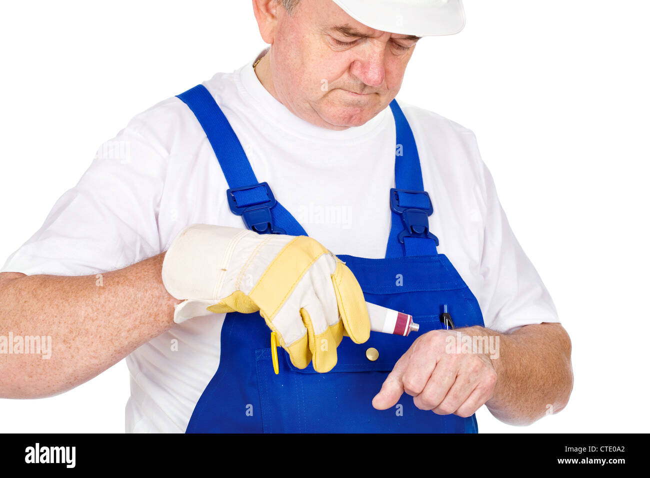 Middle age worker putting cream on his wound, isolated on white ...