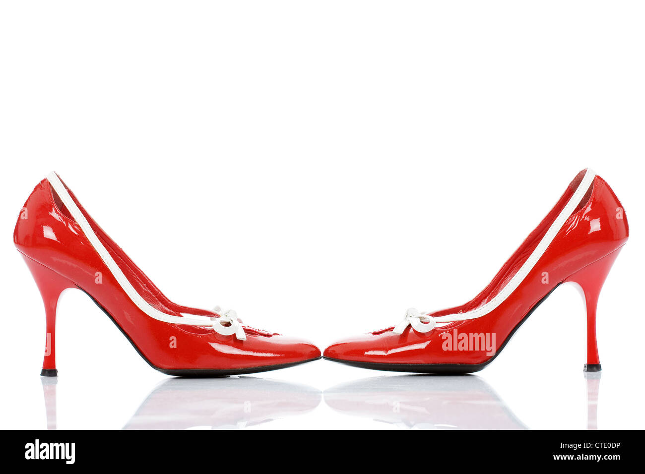 Red shiny shoes isolated on white background Stock Photo - Alamy