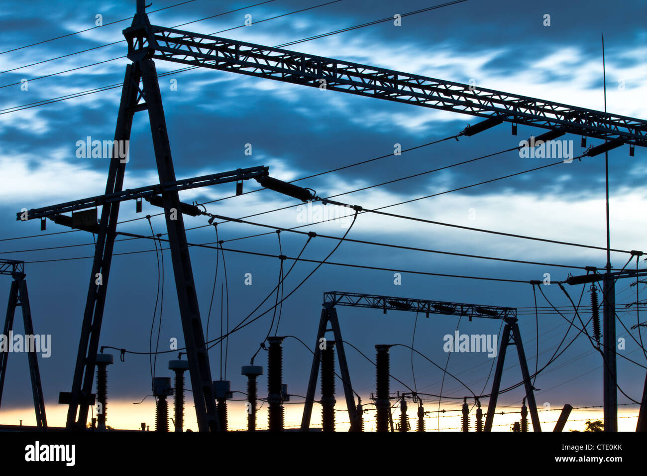 Power lines at sunset Stock Photo - Alamy