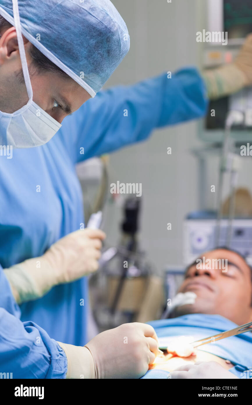 Close up young doctor wearing blue surgical cap hi-res stock ...