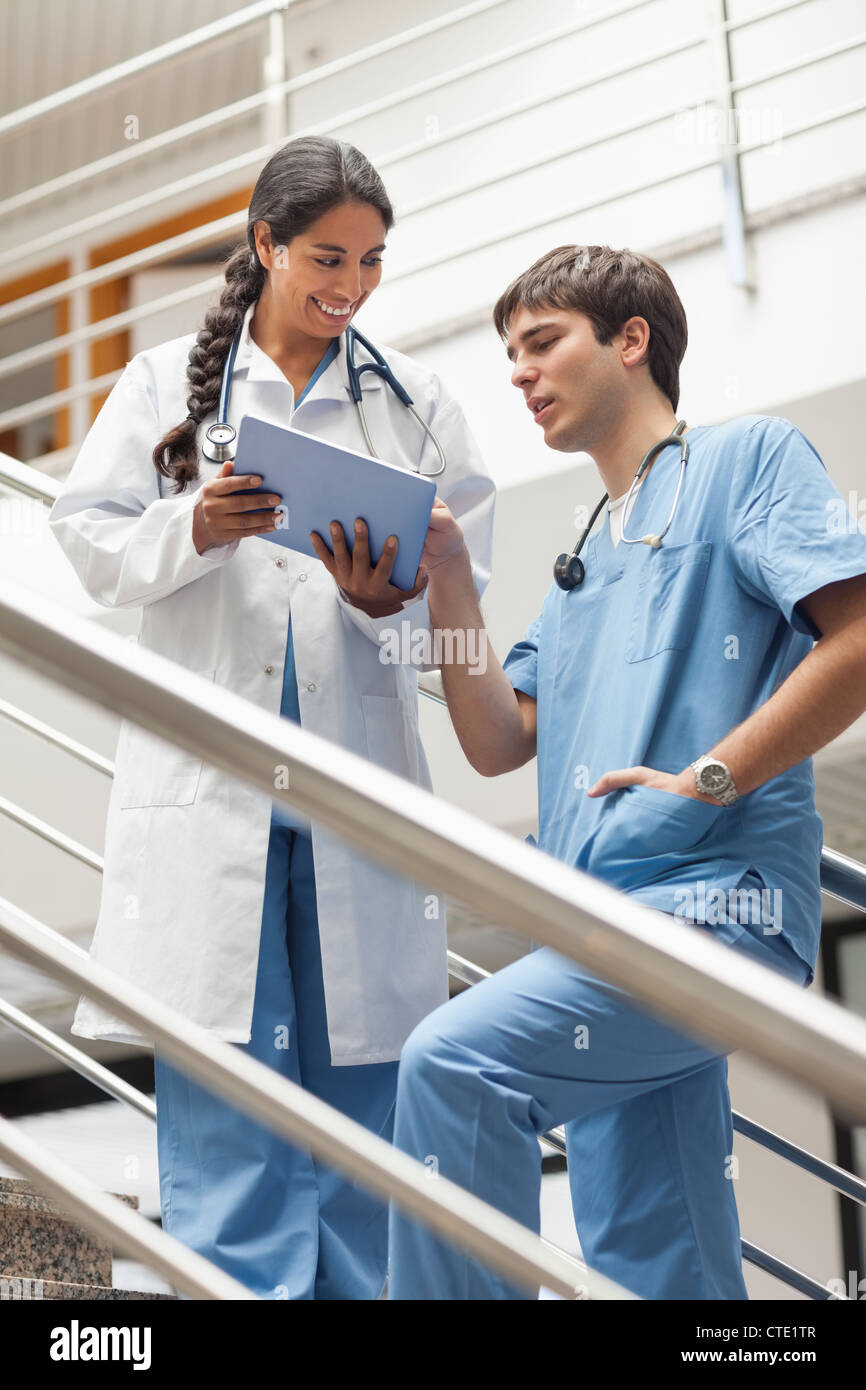 Nurse showing tablet doctor in hi-res stock photography and images - Alamy