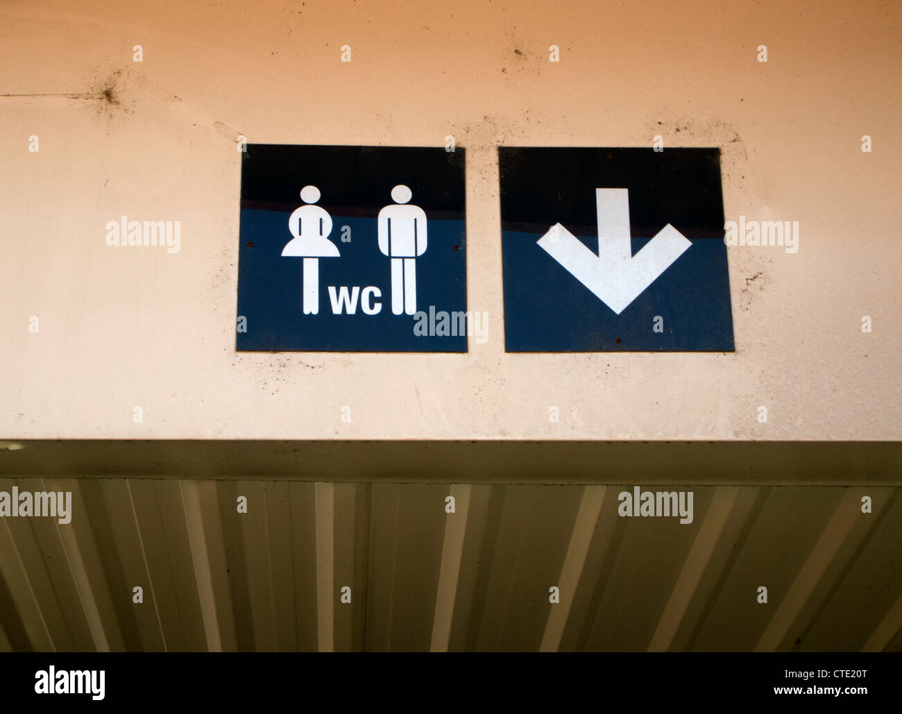 Street sign for public toilet on the wall Stock Photo - Alamy