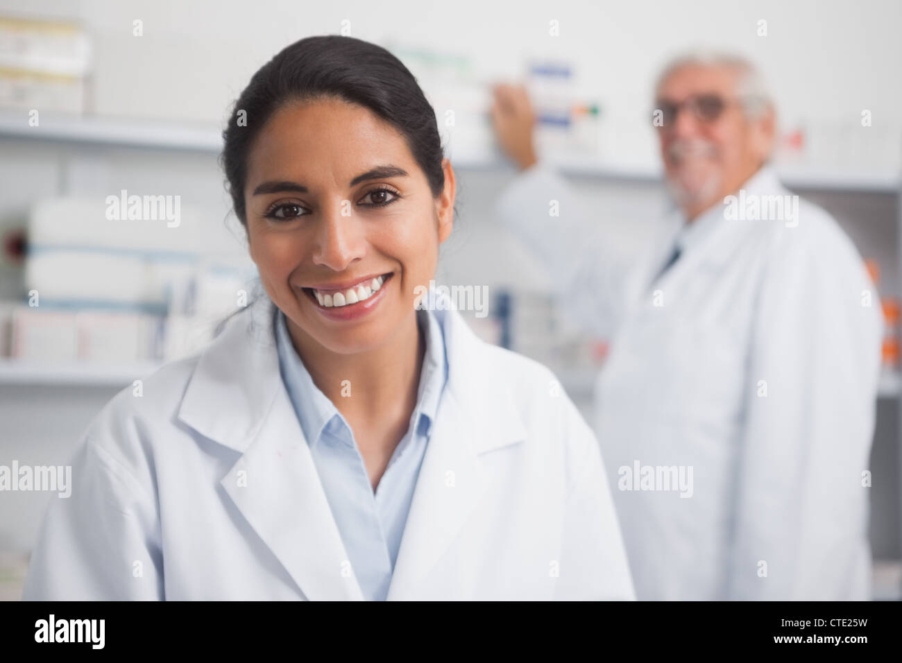 Smiling pharmacist looking at camera Stock Photo - Alamy