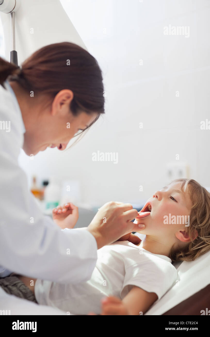 Doctor examining a child Stock Photo - Alamy