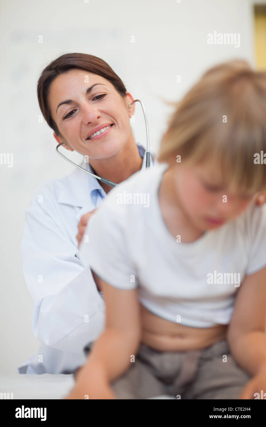 Doctor examining breathing of a child with a stethoscope Stock Photo ...