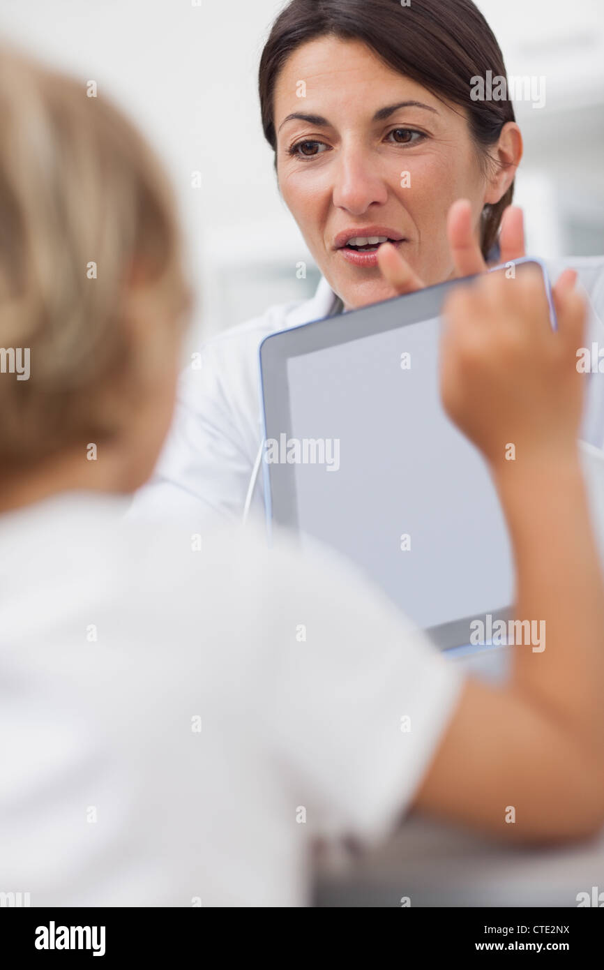 Doctor showing a tablet computer to a child Stock Photo - Alamy