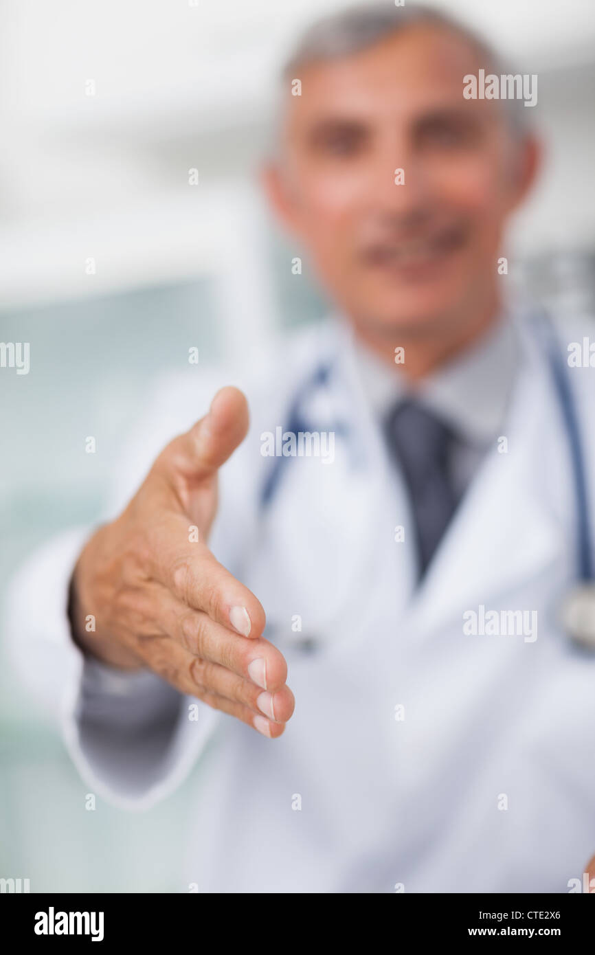 Doctor giving handshake on hi-res stock photography and images - Alamy