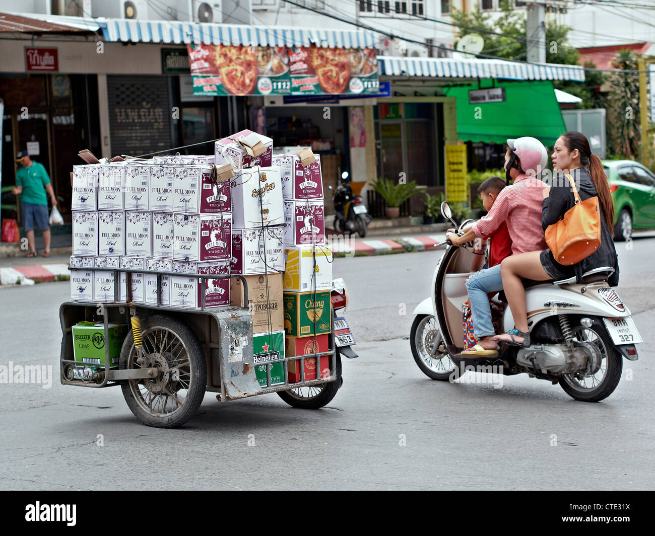 Thailand delivery driver and fully loaded drinks delivery motorcycle ...