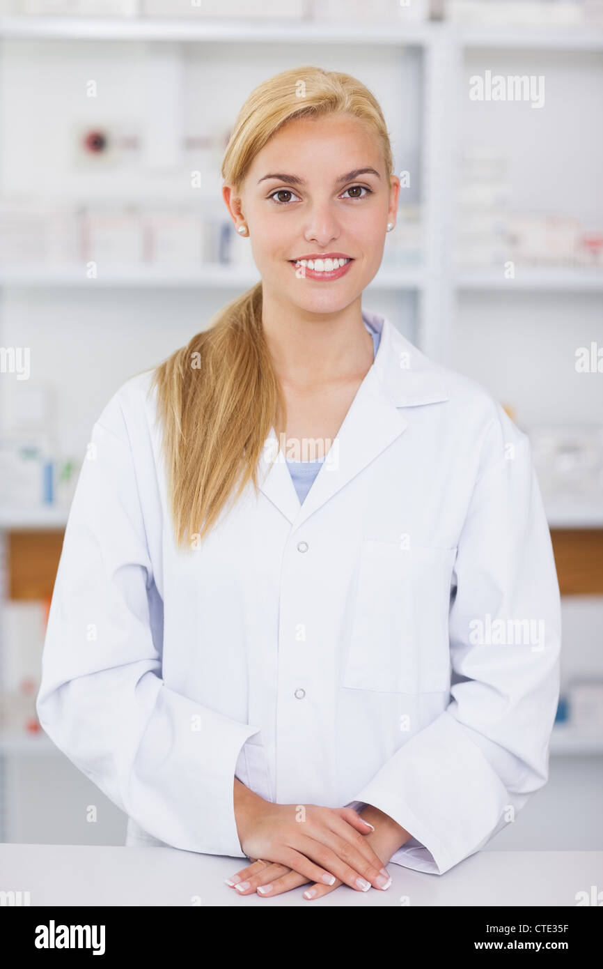 Blonde pharmacist smiling Stock Photo - Alamy