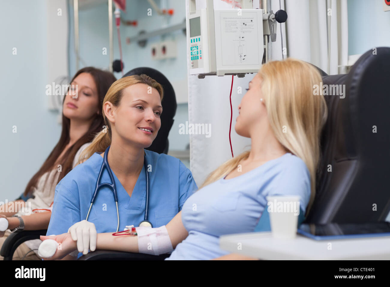 Nurse talking to a patient Stock Photo - Alamy
