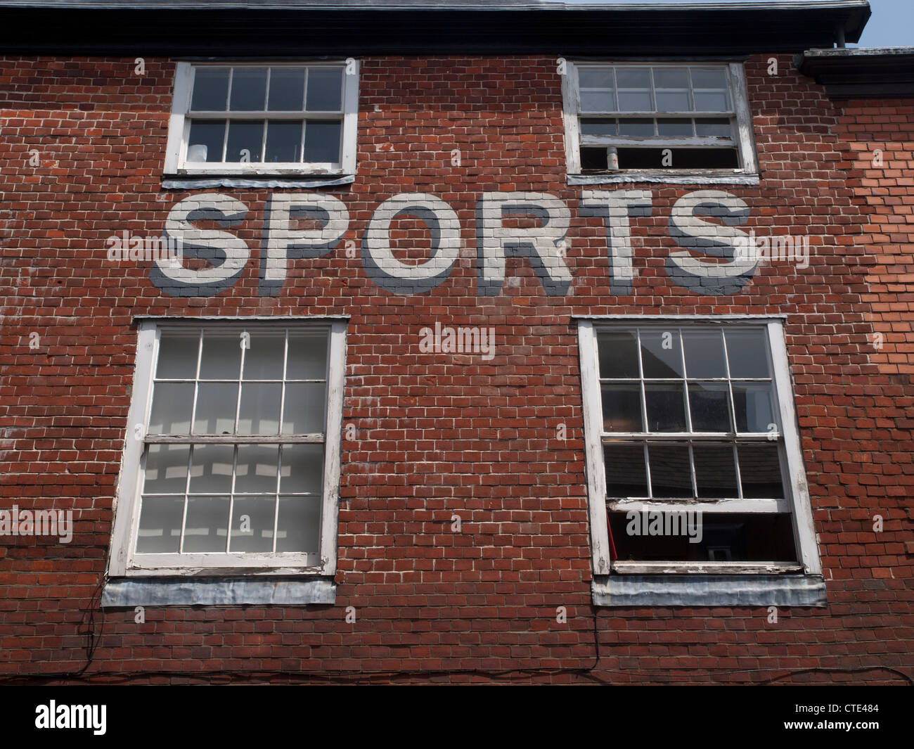 In Lewes,above a shop the old lettering painted on the wall Stock Photo ...