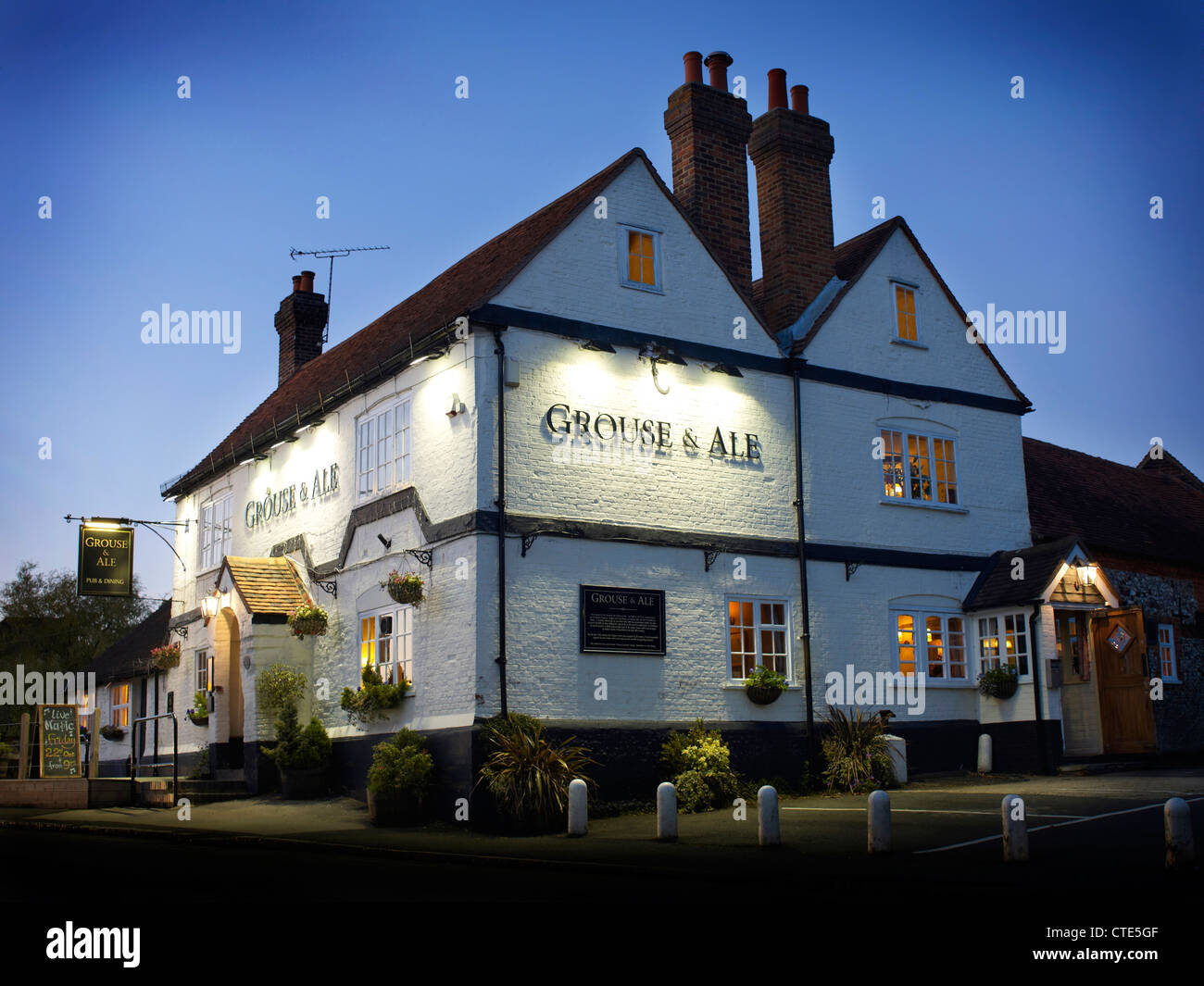 View of a traditional British pub at night Stock Photo - Alamy