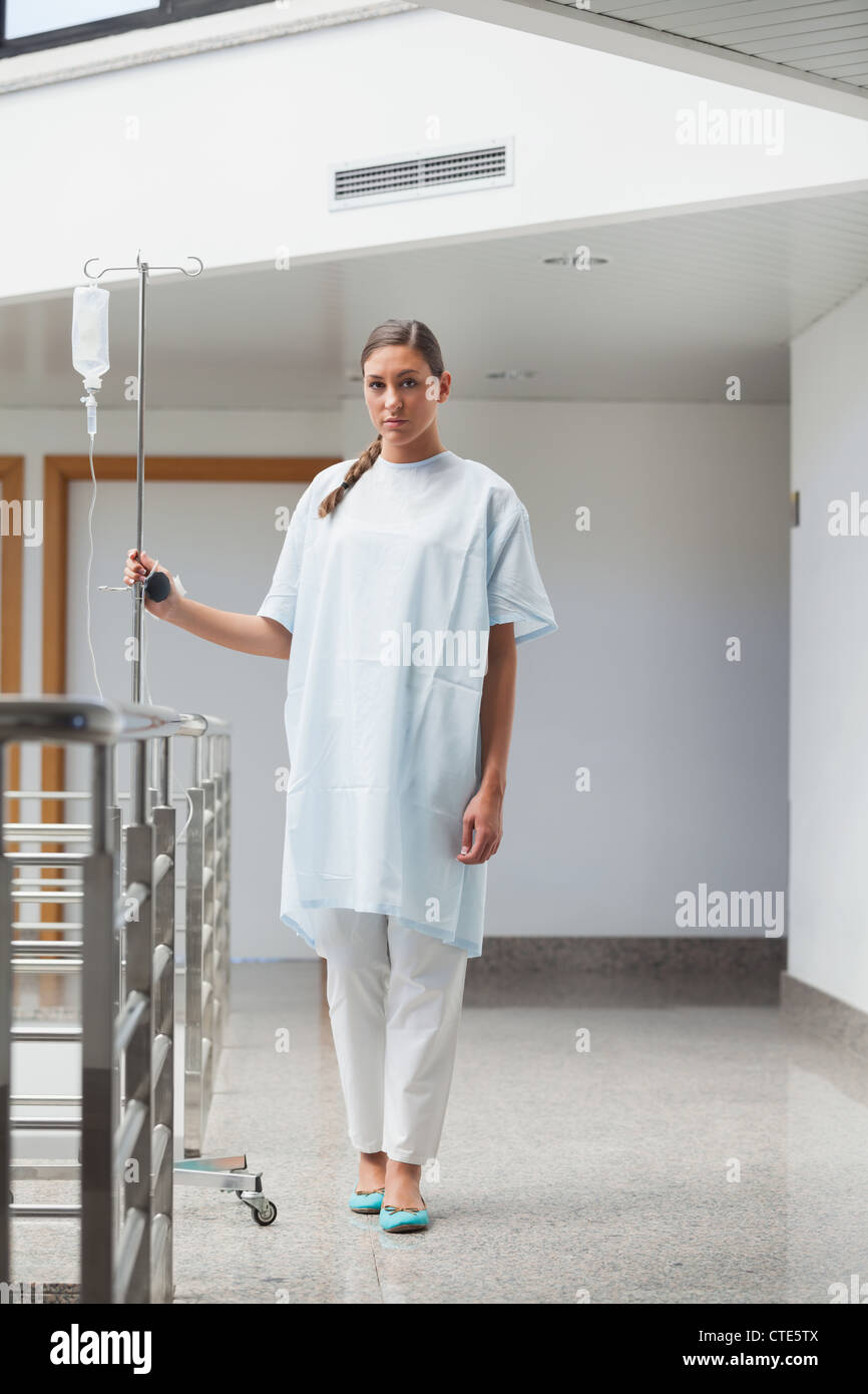 Patient walking with a drip stand Stock Photo - Alamy