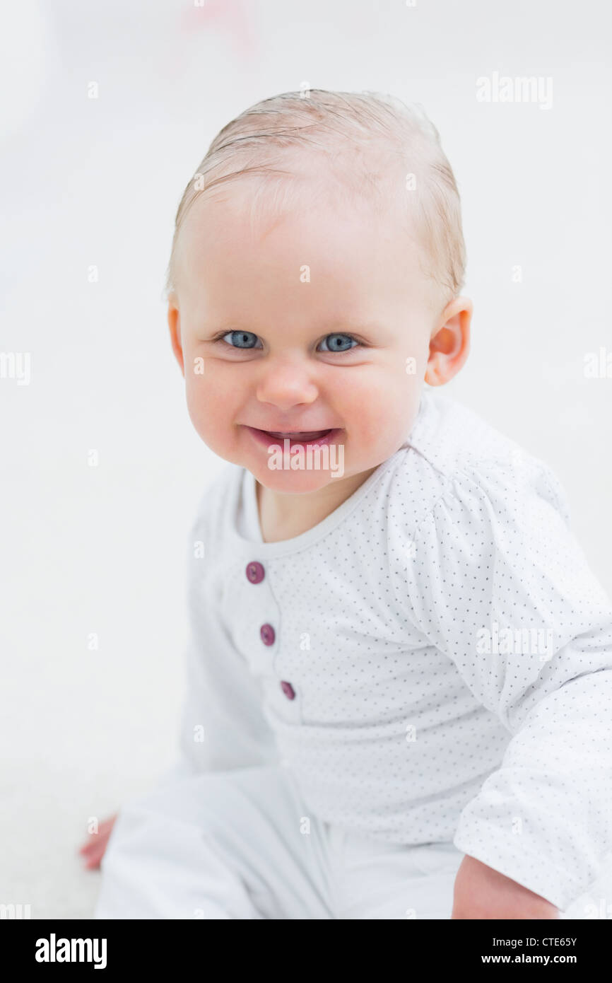 Baby looking at camera while smiling Stock Photo - Alamy