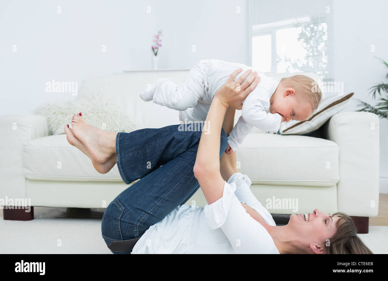 Baby on mother back hi-res stock photography and images - Alamy