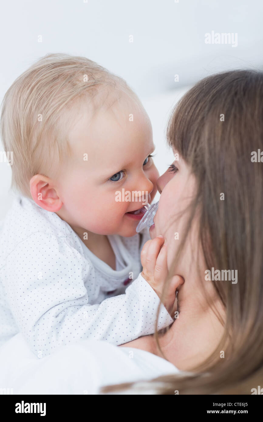 Baby catching a pacifier Stock Photo - Alamy
