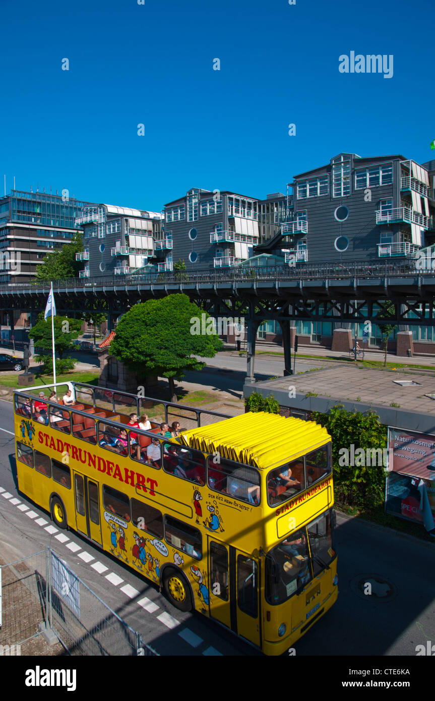 Sightseeing tour bus going through HafenCity warehouse district Hamburg ...
