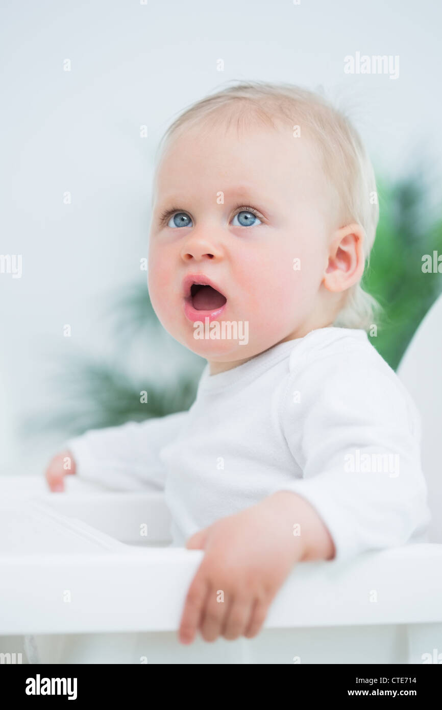 Cute baby girl sitting on a chair hi-res stock photography and images ...