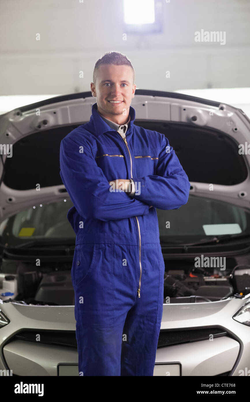 Mechanic with arms crossed Stock Photo - Alamy